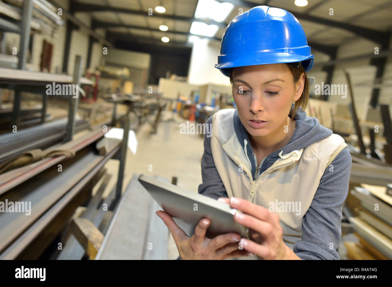 Woman engineer in steel plant checking production Stock Photo - Alamy