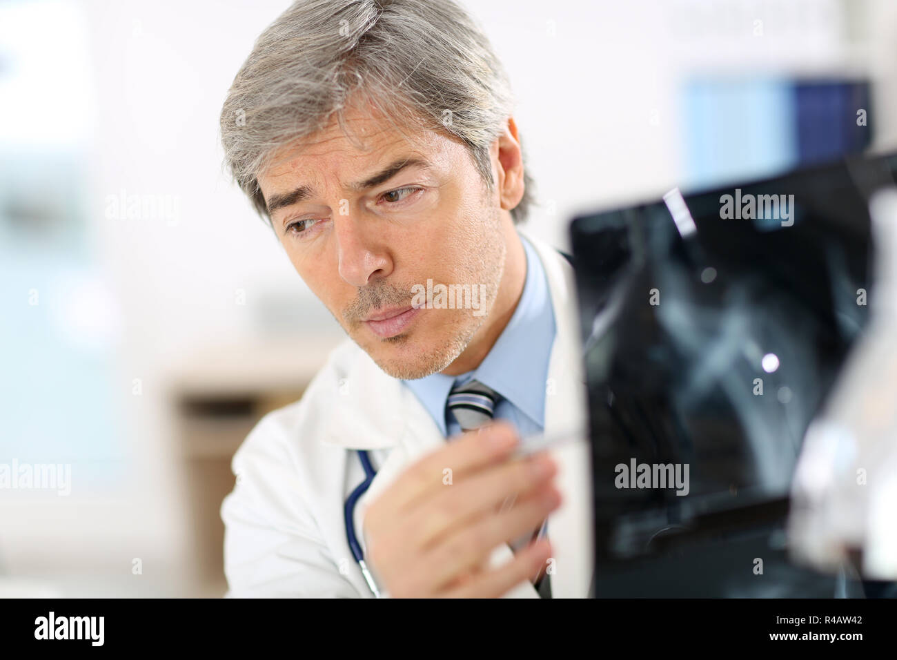 Doctor checking test results on hi-res stock photography and images - Alamy
