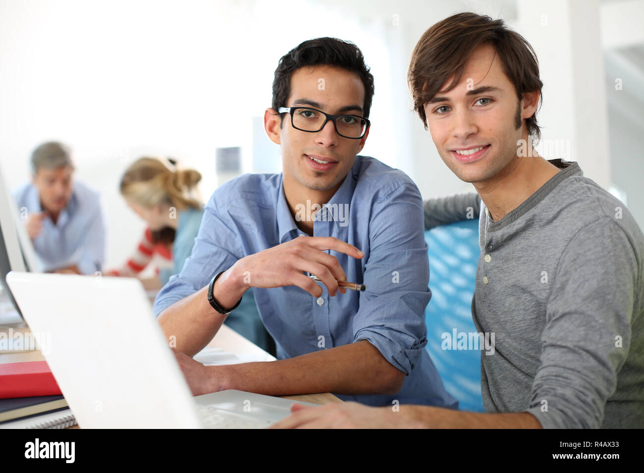 College students working together on project Stock Photo - Alamy