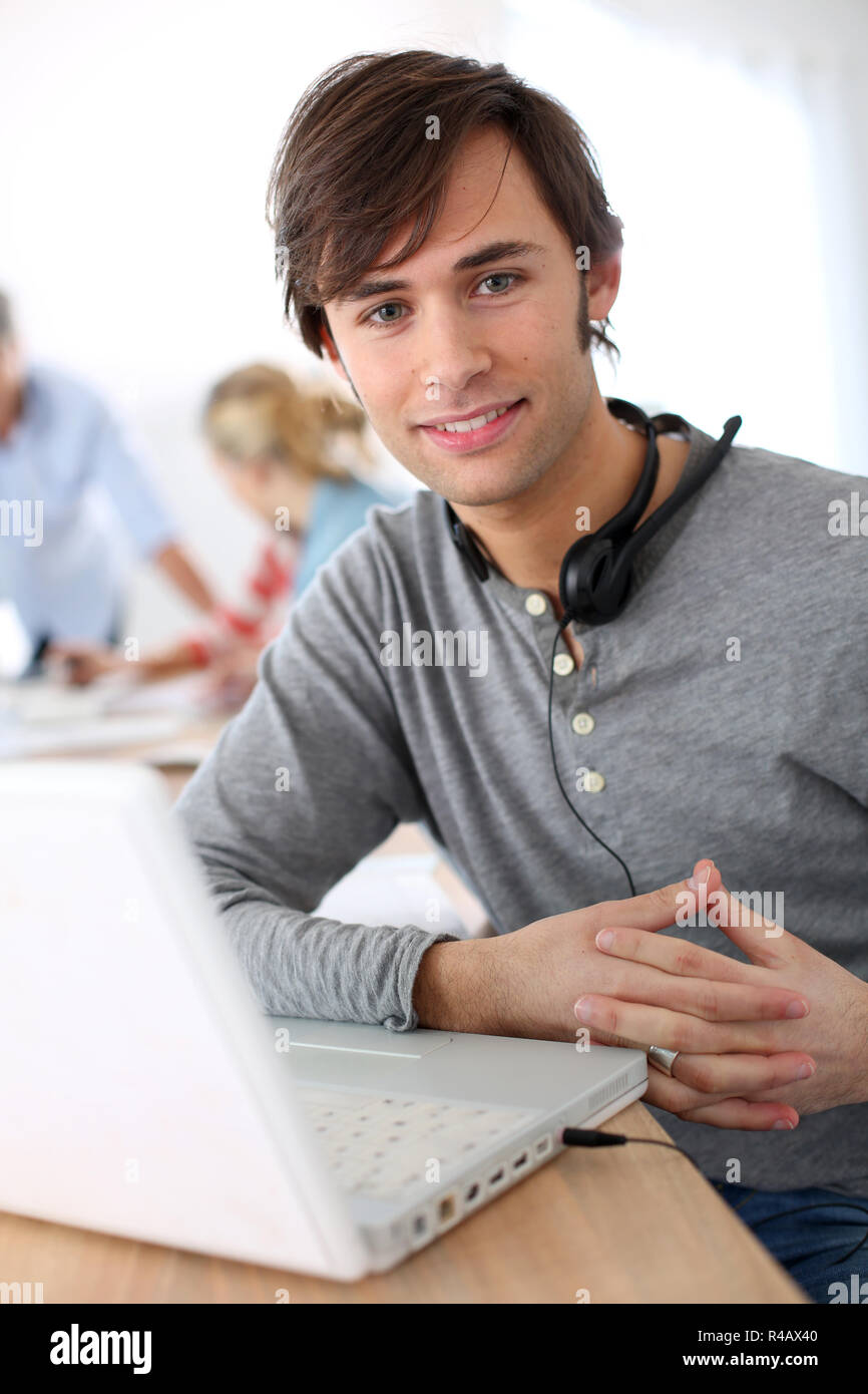 Student with headset on doing English language test Stock Photo - Alamy
