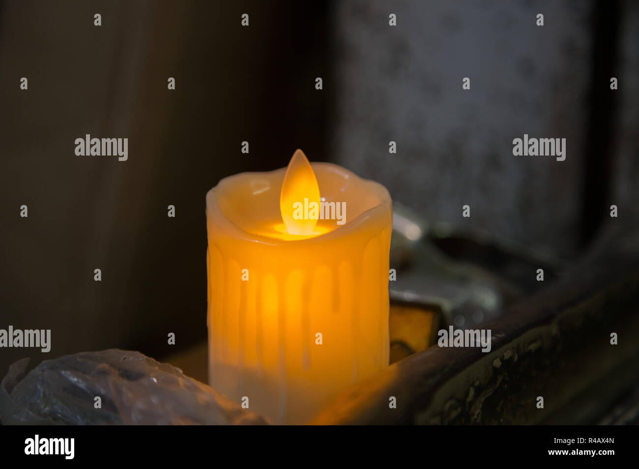 yellow LED candles in the dark Stock Photo - Alamy