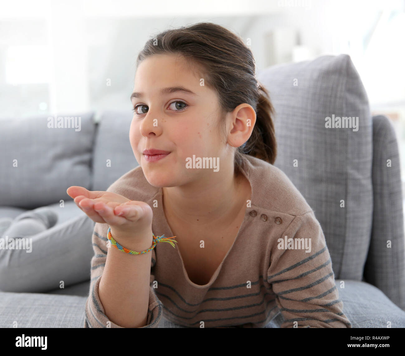 Cute little girl sending kiss goodbye Stock Photo - Alamy