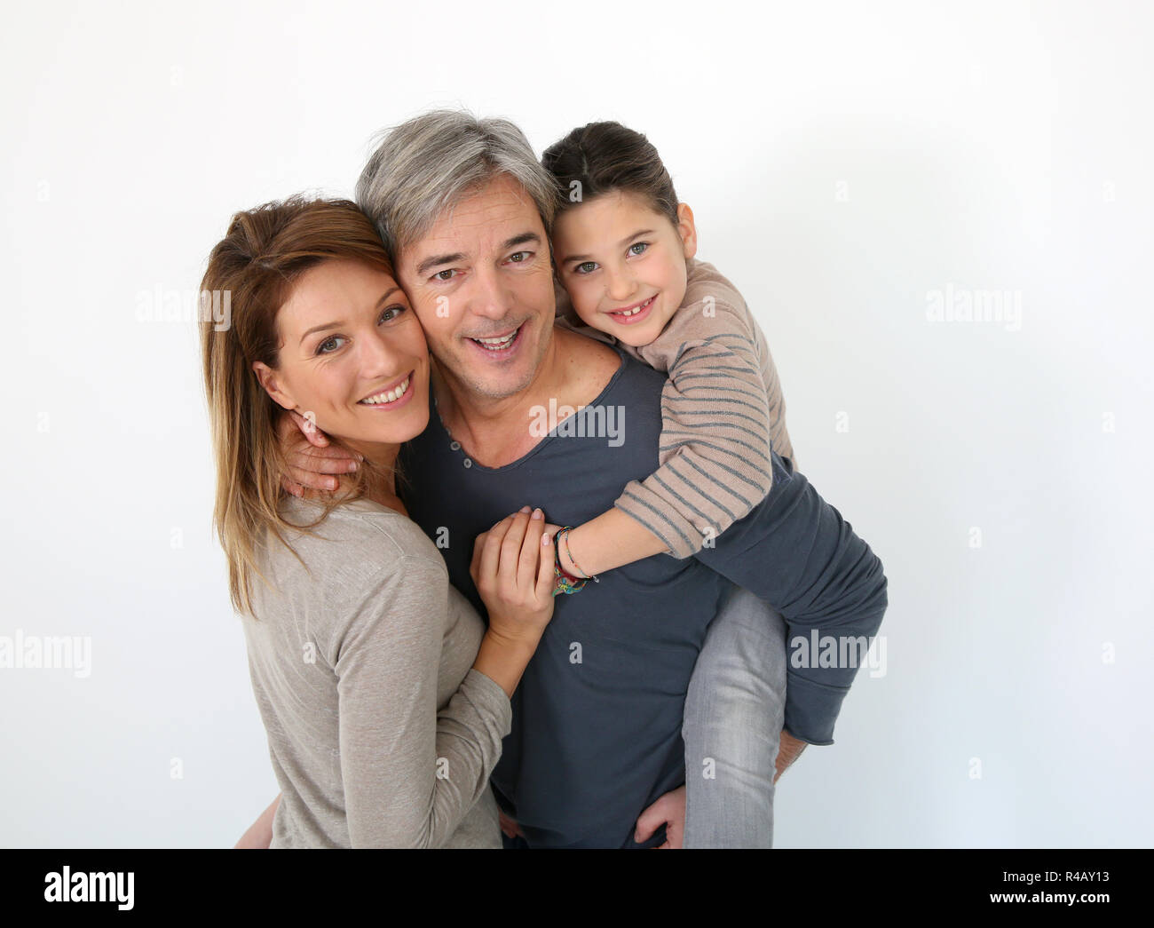 Happy family of three standing on white background Stock Photo - Alamy
