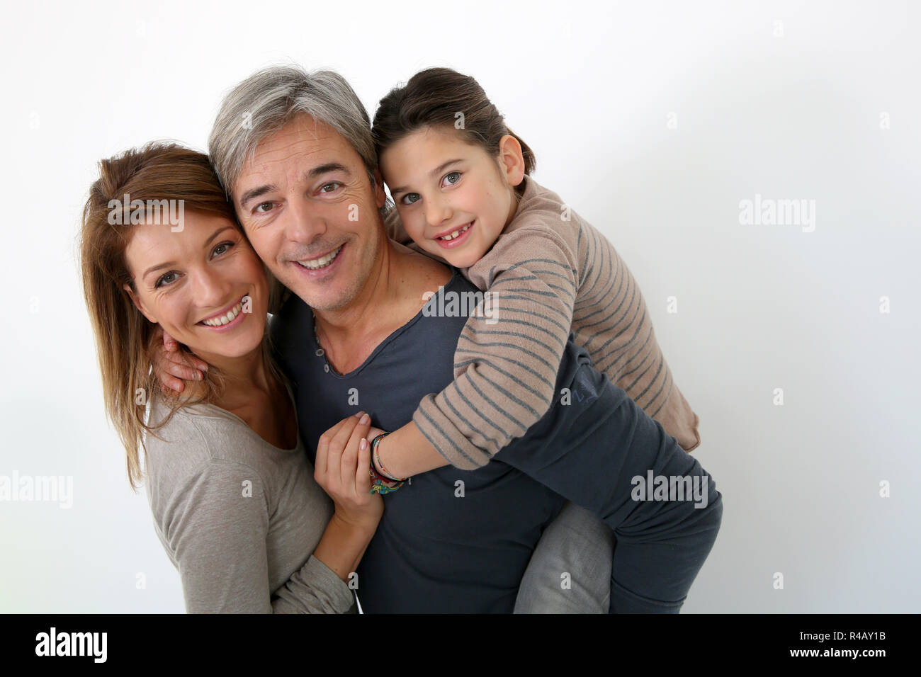 Happy family of three standing on white background Stock Photo - Alamy