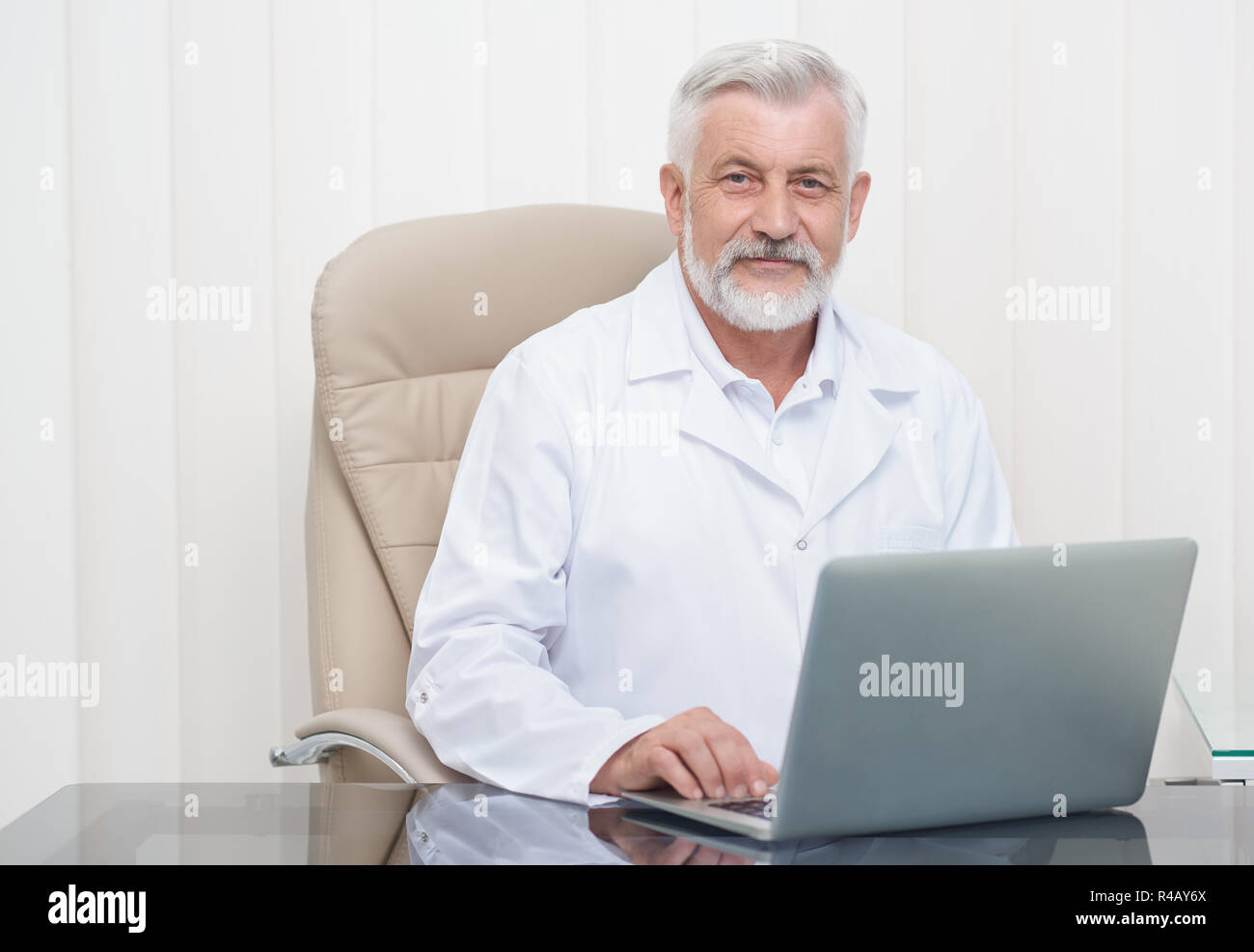 Handsome elderly doctor in uniform hi-res stock photography and images ...