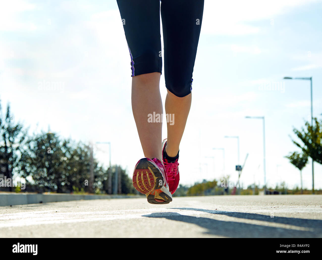 Lonely runner on road hi-res stock photography and images - Alamy
