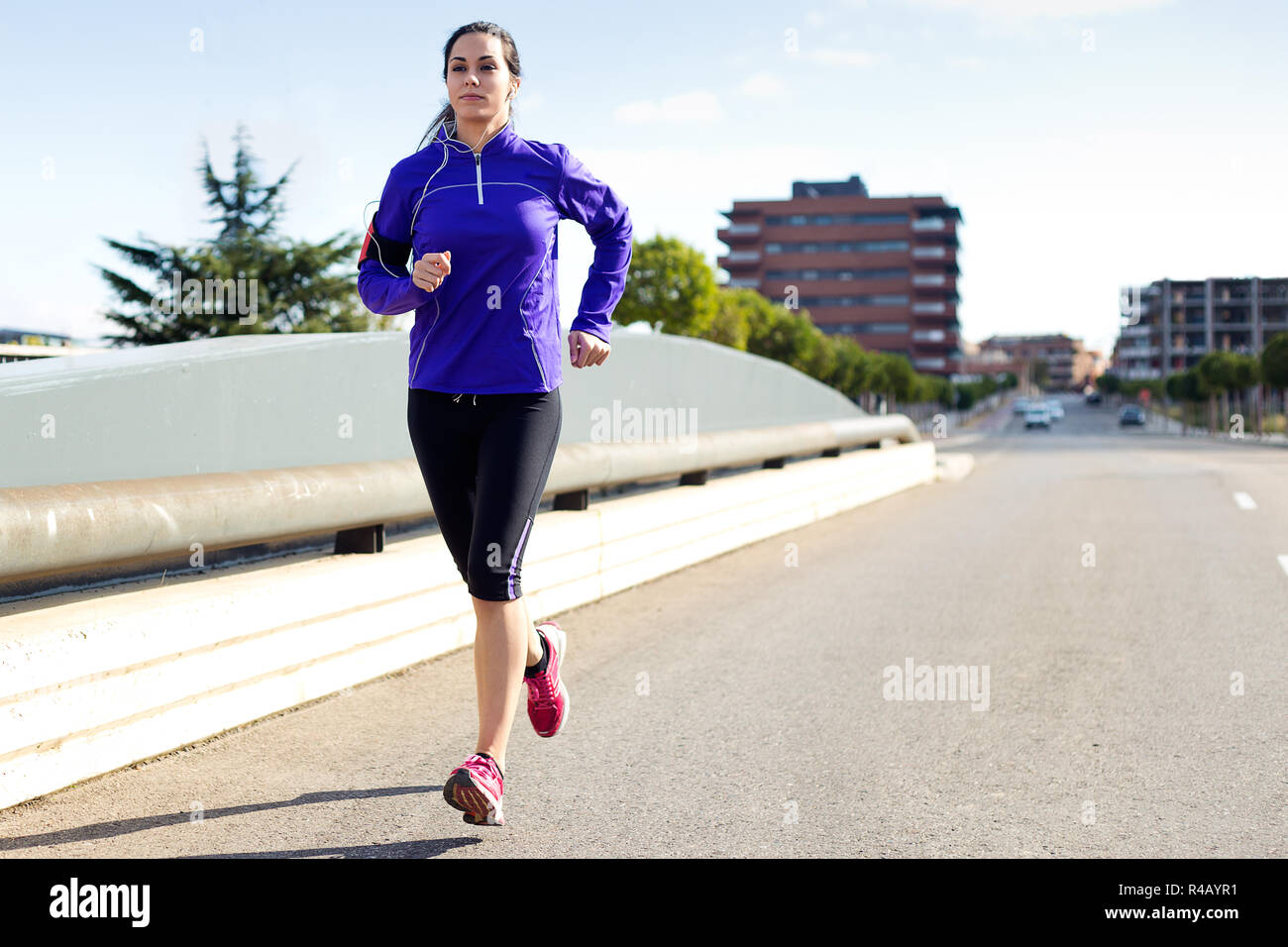Running in city hi-res stock photography and images - Alamy