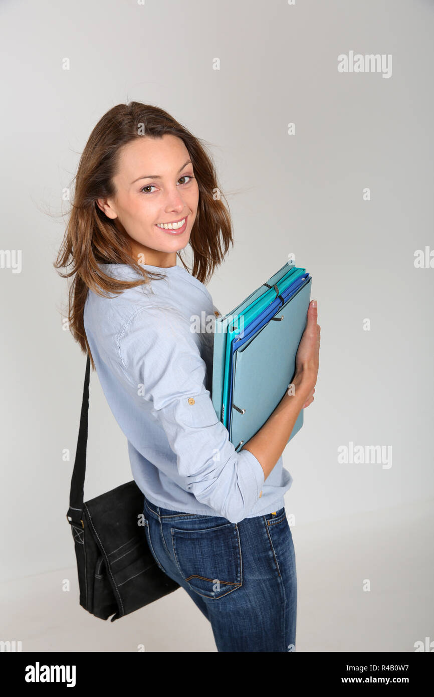 Cheerful student girl holding files Stock Photo - Alamy