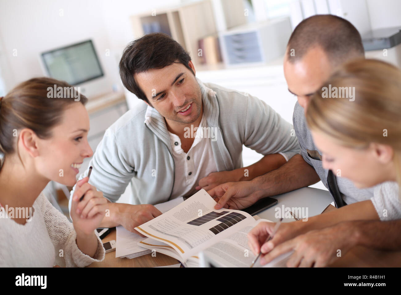 College people studying together in school lounge Stock Photo - Alamy