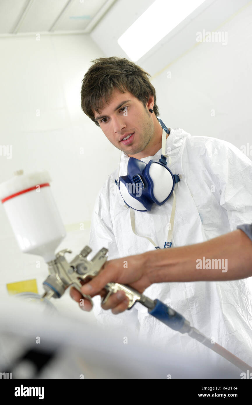 Young adult in car painting training class Stock Photo - Alamy