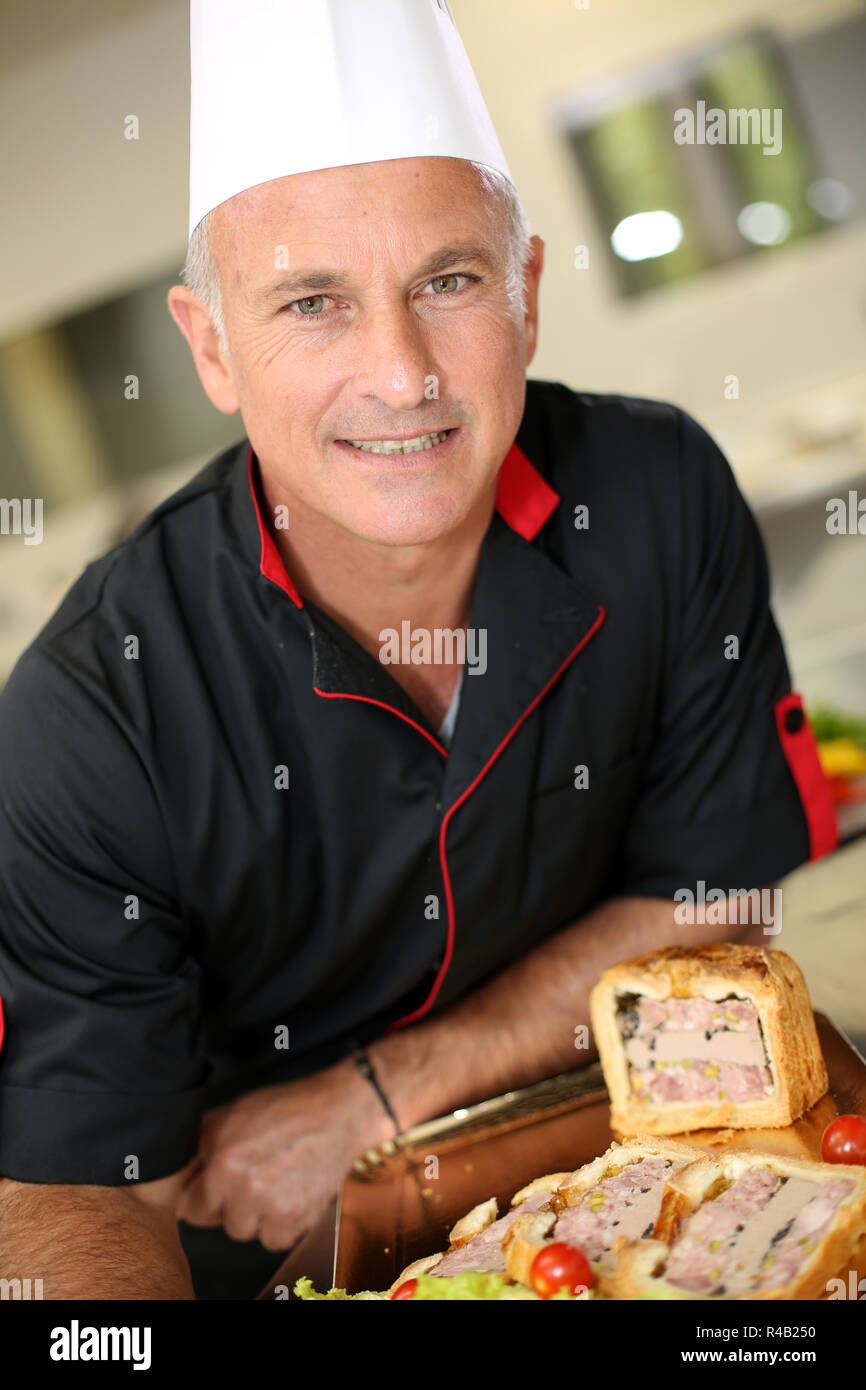 Portrait of smiling chef with uniform Stock Photo - Alamy