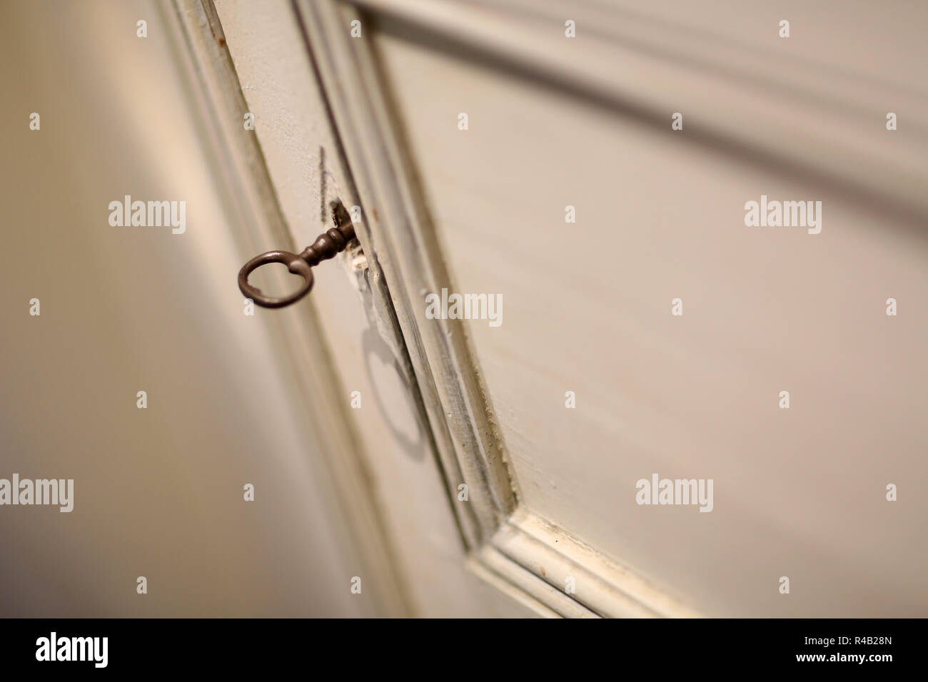 Detail of key in wooden door lock Stock Photo - Alamy