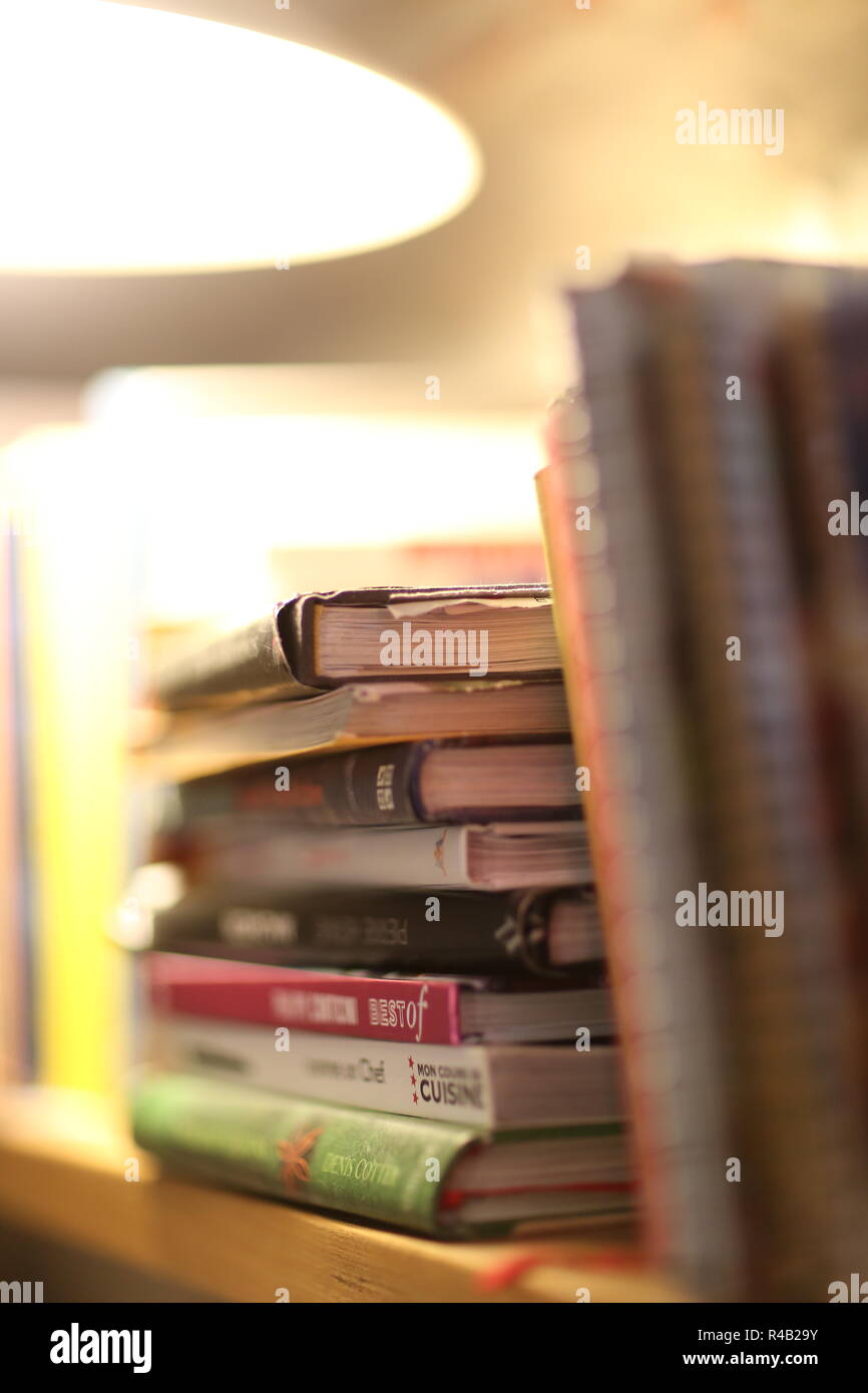 Cooking books set on kitchen shelf Stock Photo - Alamy
