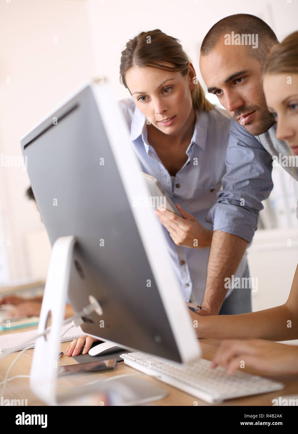 Business people working on project in office Stock Photo - Alamy
