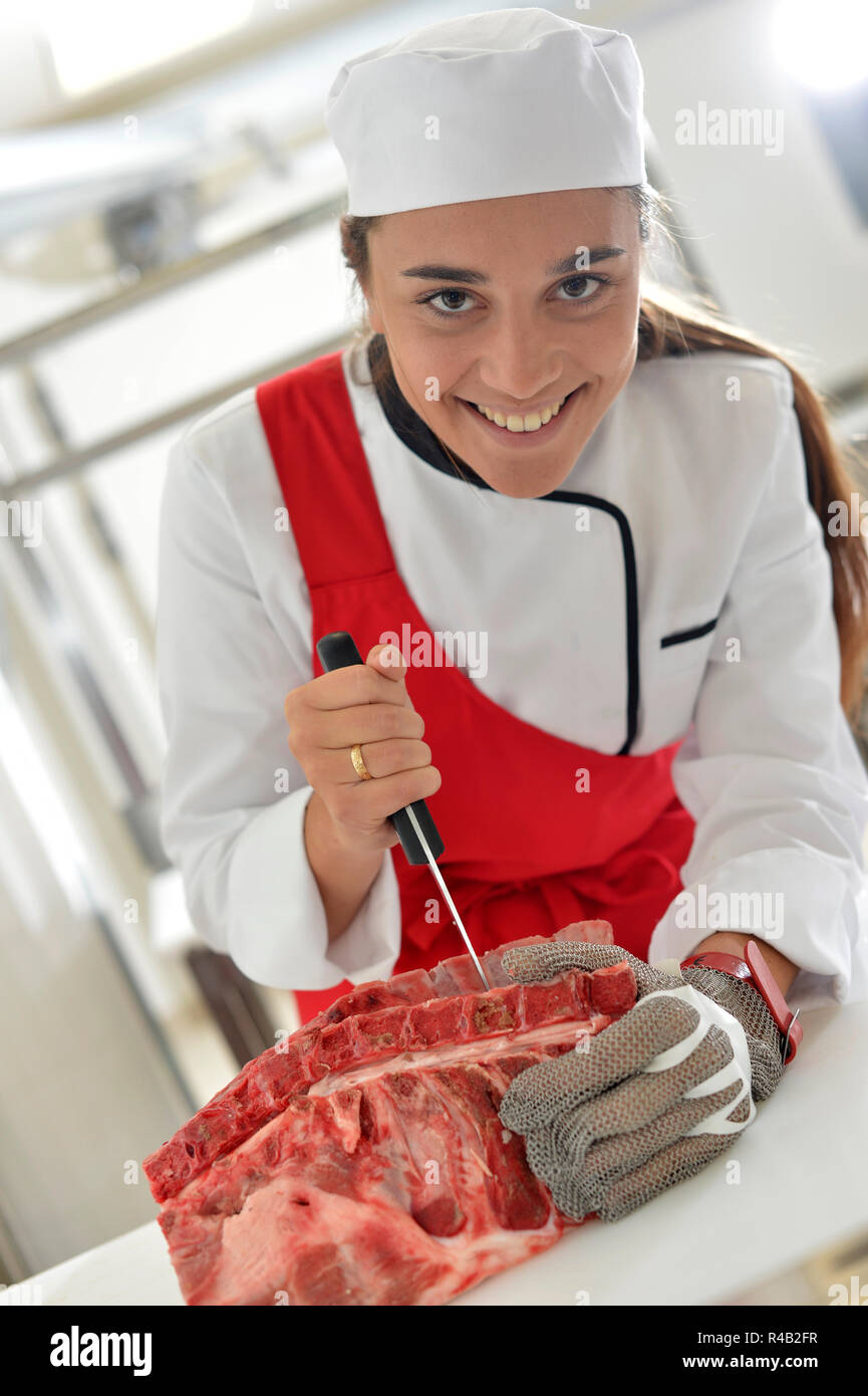 Butcher uniform cutting ribs hi-res stock photography and images - Alamy