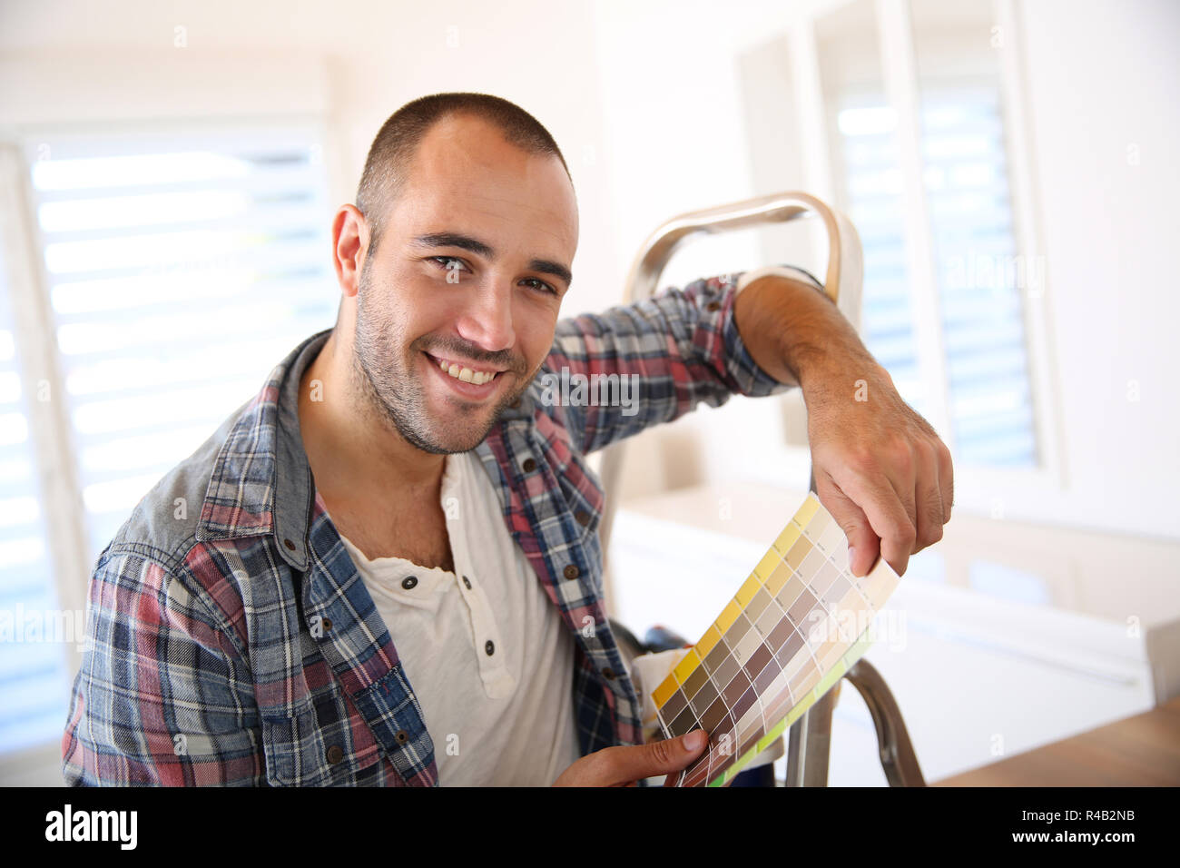 Single man moving in new home Stock Photo - Alamy