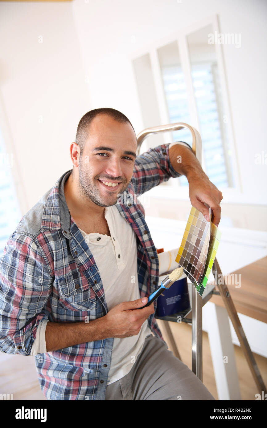 Single man moving in new home Stock Photo - Alamy