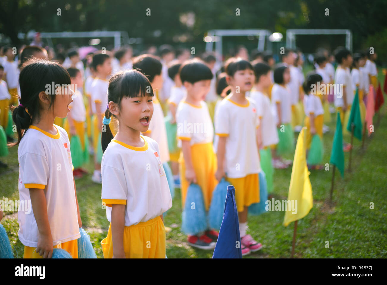 Children singing national anthem during their kindergarten sports day ...