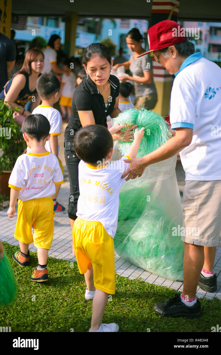 Children collecting pom-pom from children during their kindergarten ...