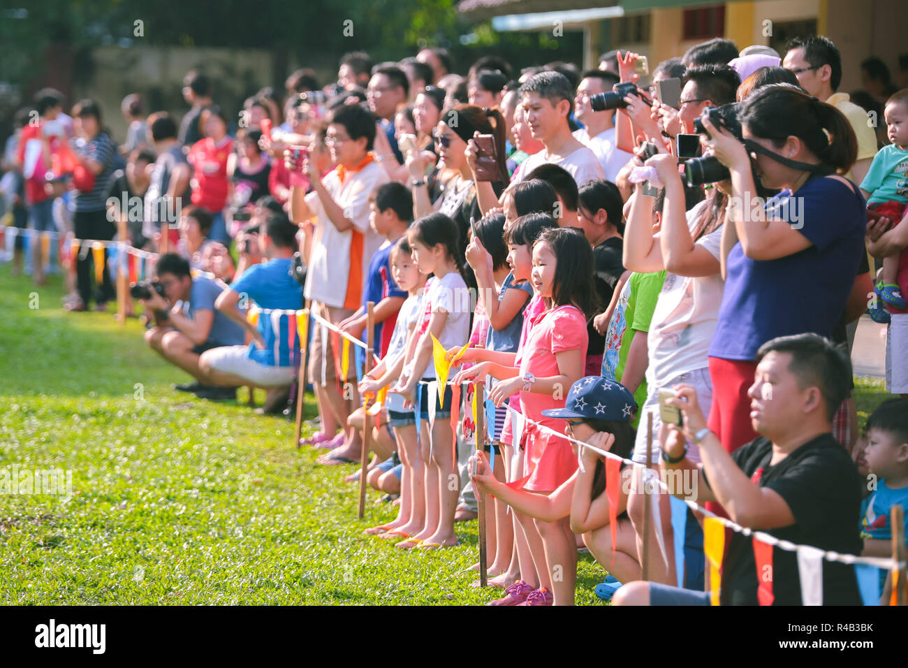 Proud parents attending their children kindergarten sports day Stock ...