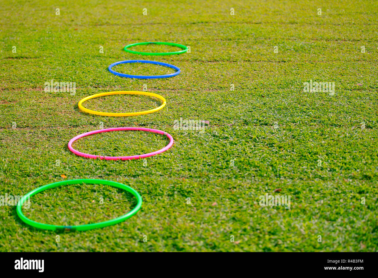 Hula hoops lying on the field Stock Photo - Alamy