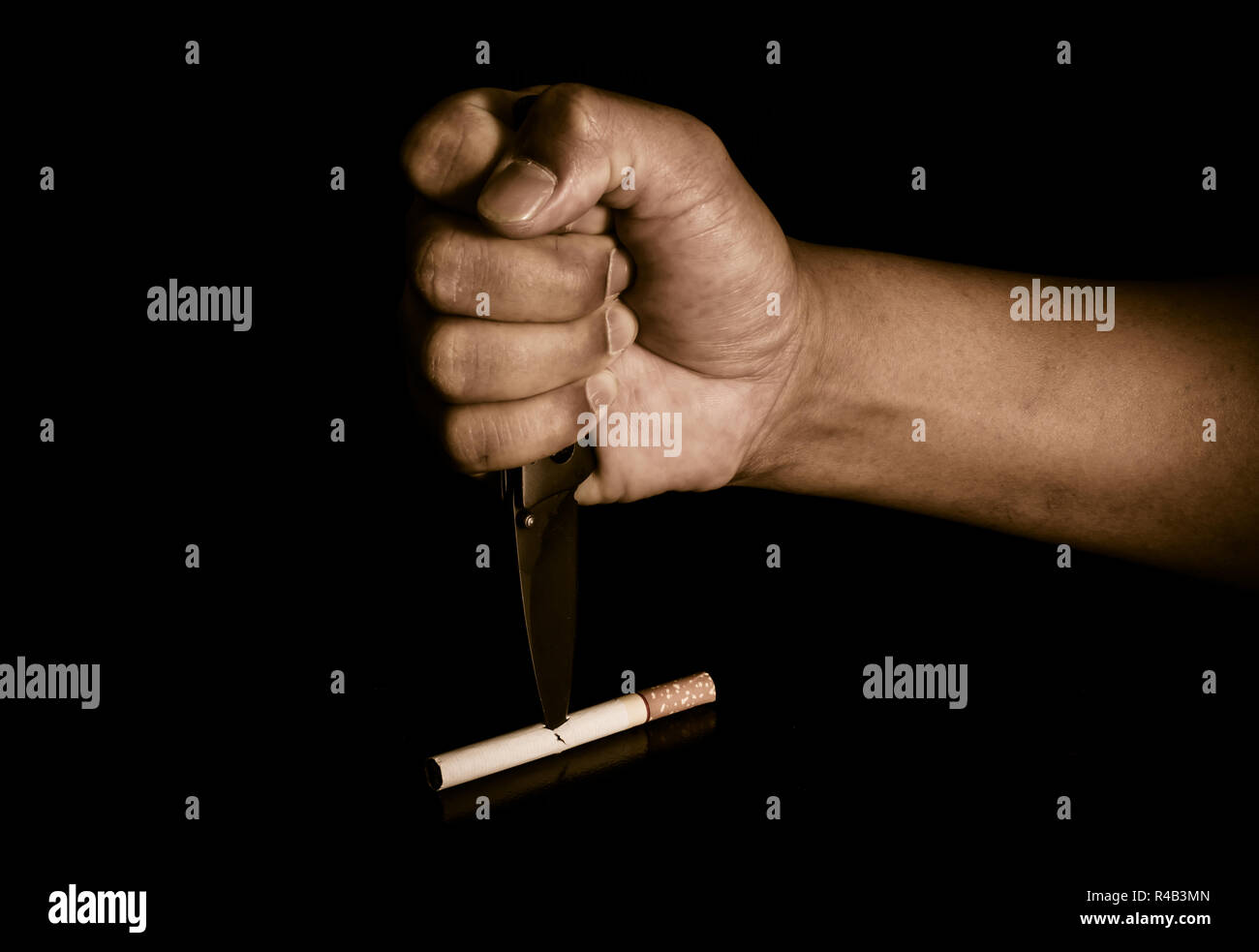 Handle knife stabbed into cigarettes concept eliminate smoking, quit ...