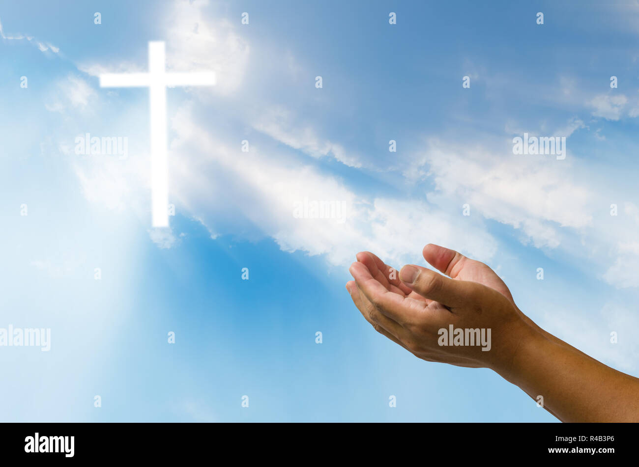 Pray for God's blessing Cross on natural background Stock Photo - Alamy