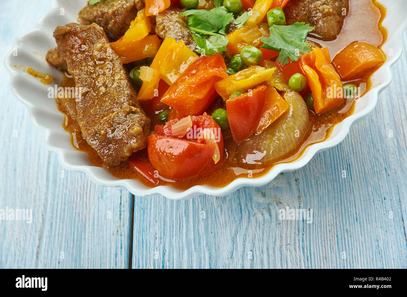 Filipino Beef Kaldereta, dish is cooked in a tomato-based sauce with ...