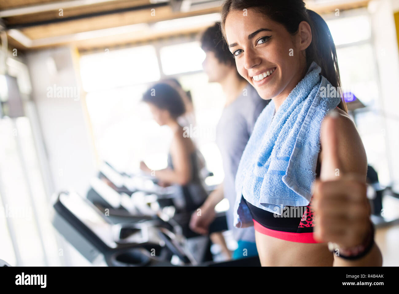 Group of healthy fit people at the gym exercising Stock Photo - Alamy