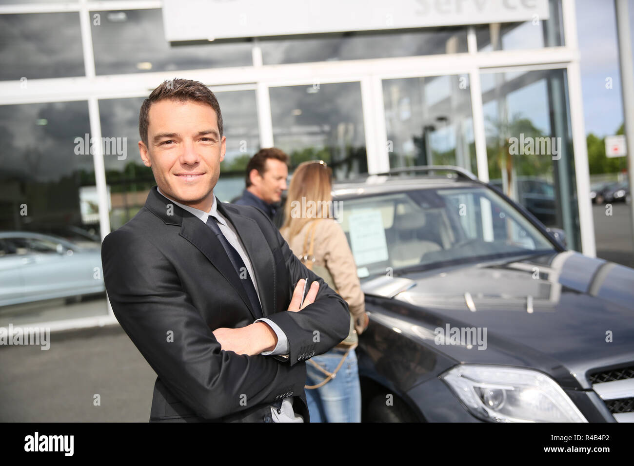 Portrait of car dealer Stock Photo - Alamy