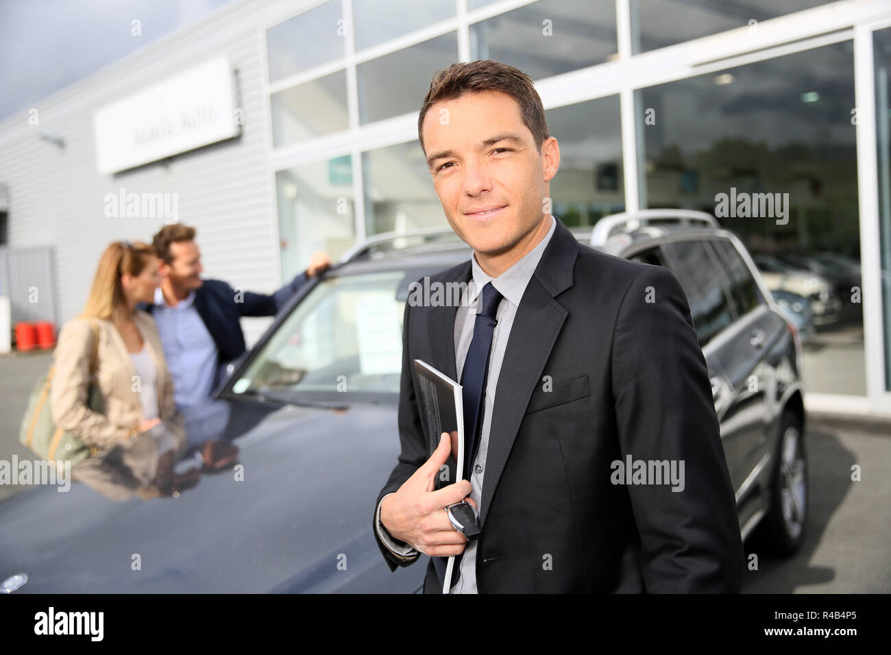 Portrait of car dealer Stock Photo - Alamy