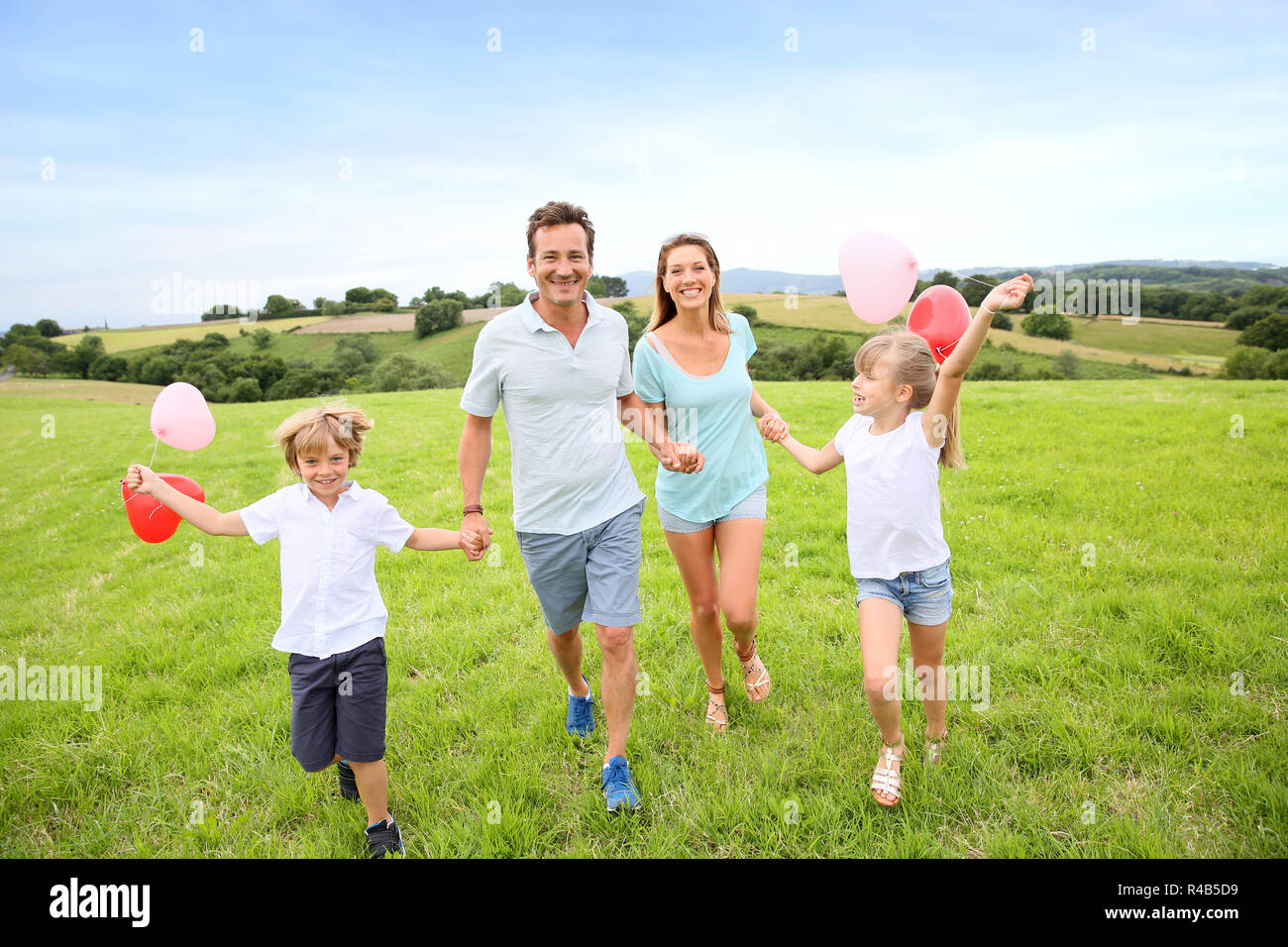 Happy family child play runs hi-res stock photography and images - Alamy