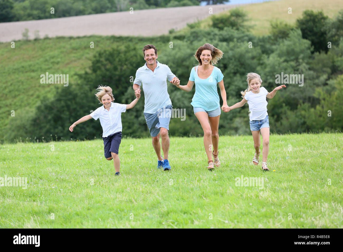 Happy family child play runs hi-res stock photography and images - Alamy