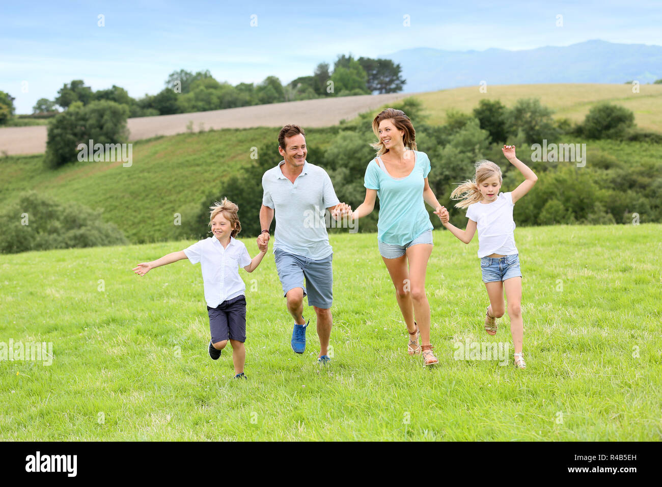 Happy family played children in hi-res stock photography and images - Alamy