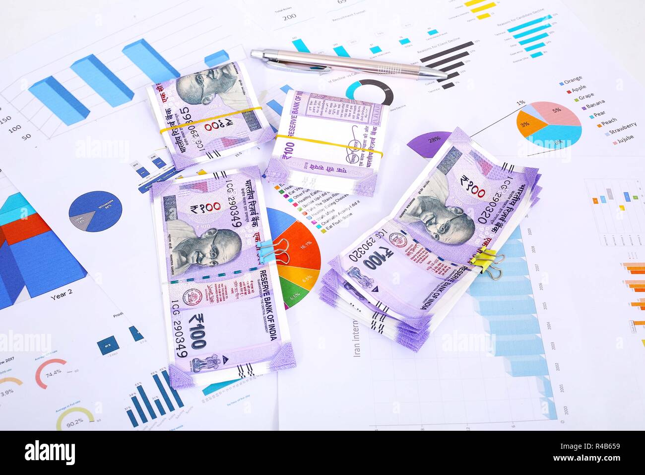 New Indian currency with pen and graph paper Stock Photo - Alamy