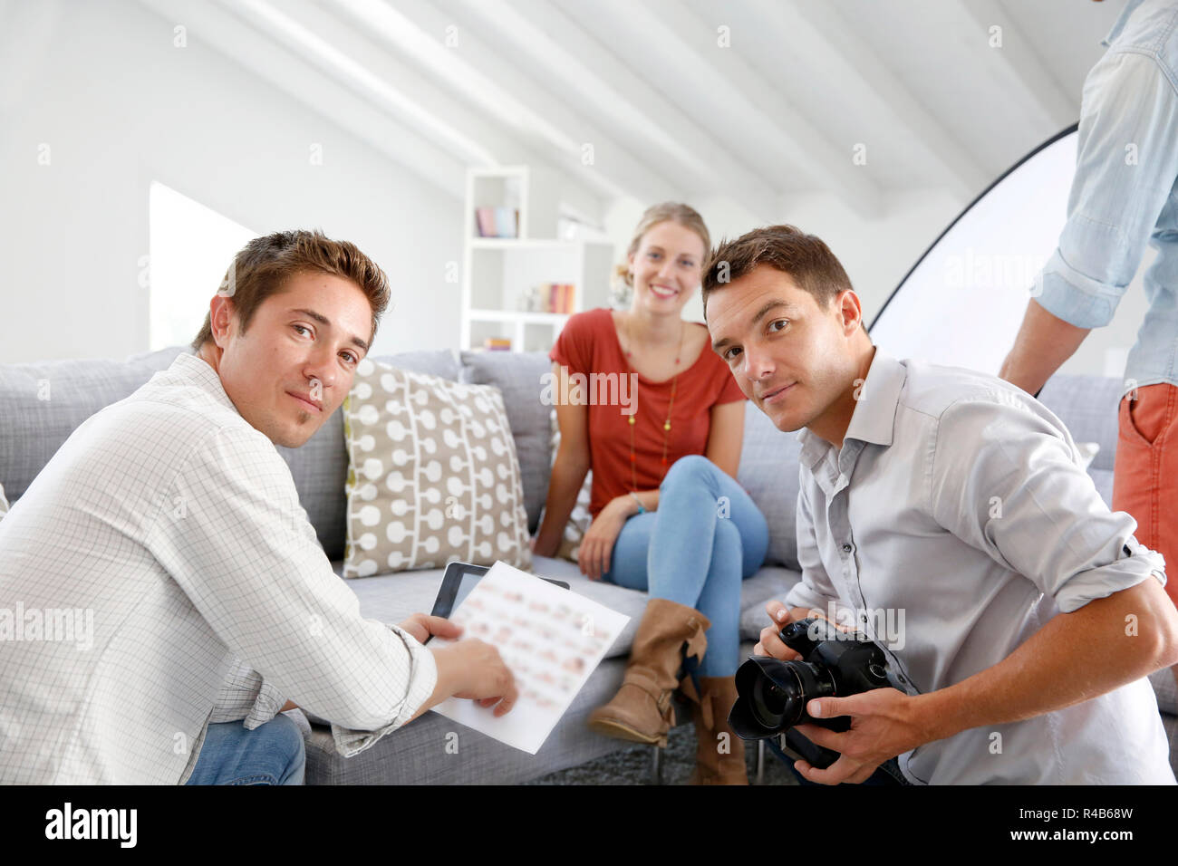 Team of photographers on a shooting day in studio Stock Photo - Alamy
