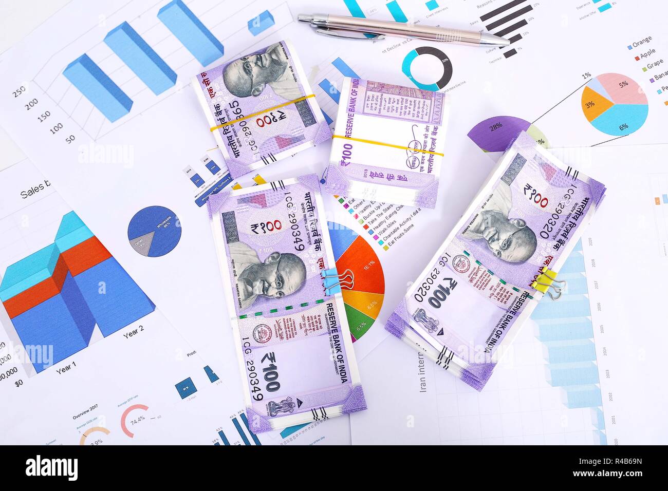 New Indian currency notes with chart paper and pen Stock Photo - Alamy