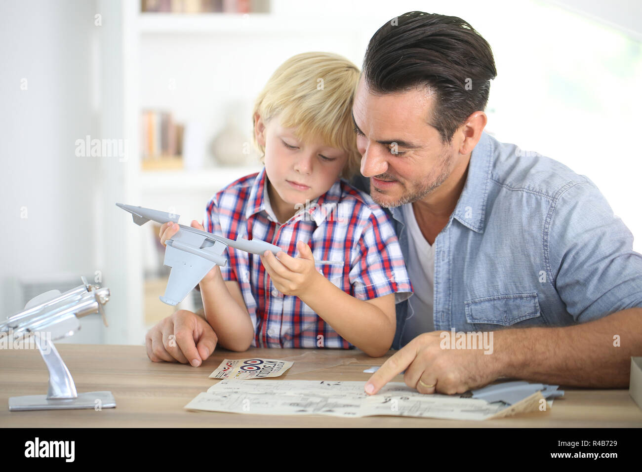 Child modeling adult hi-res stock photography and images - Alamy