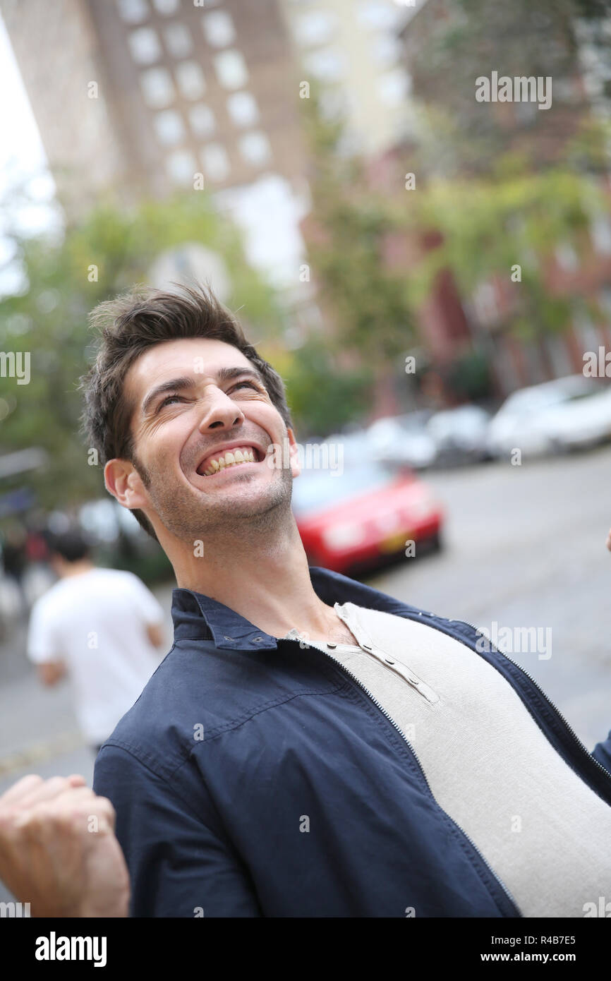 Man expressing happiness and success in the street Stock Photo - Alamy