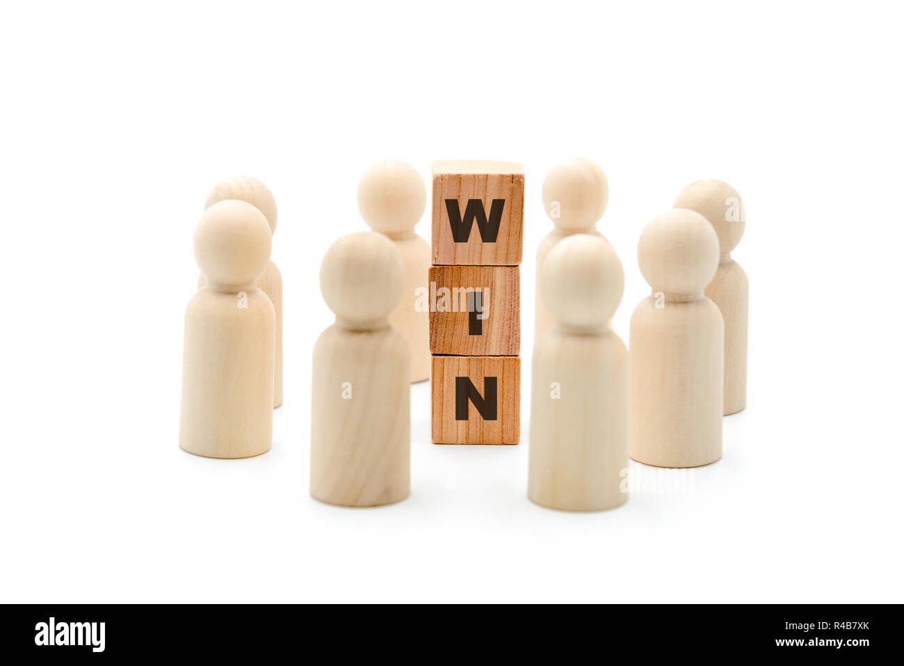 Wooden figures as business team in circle around word WIN, isolated on ...