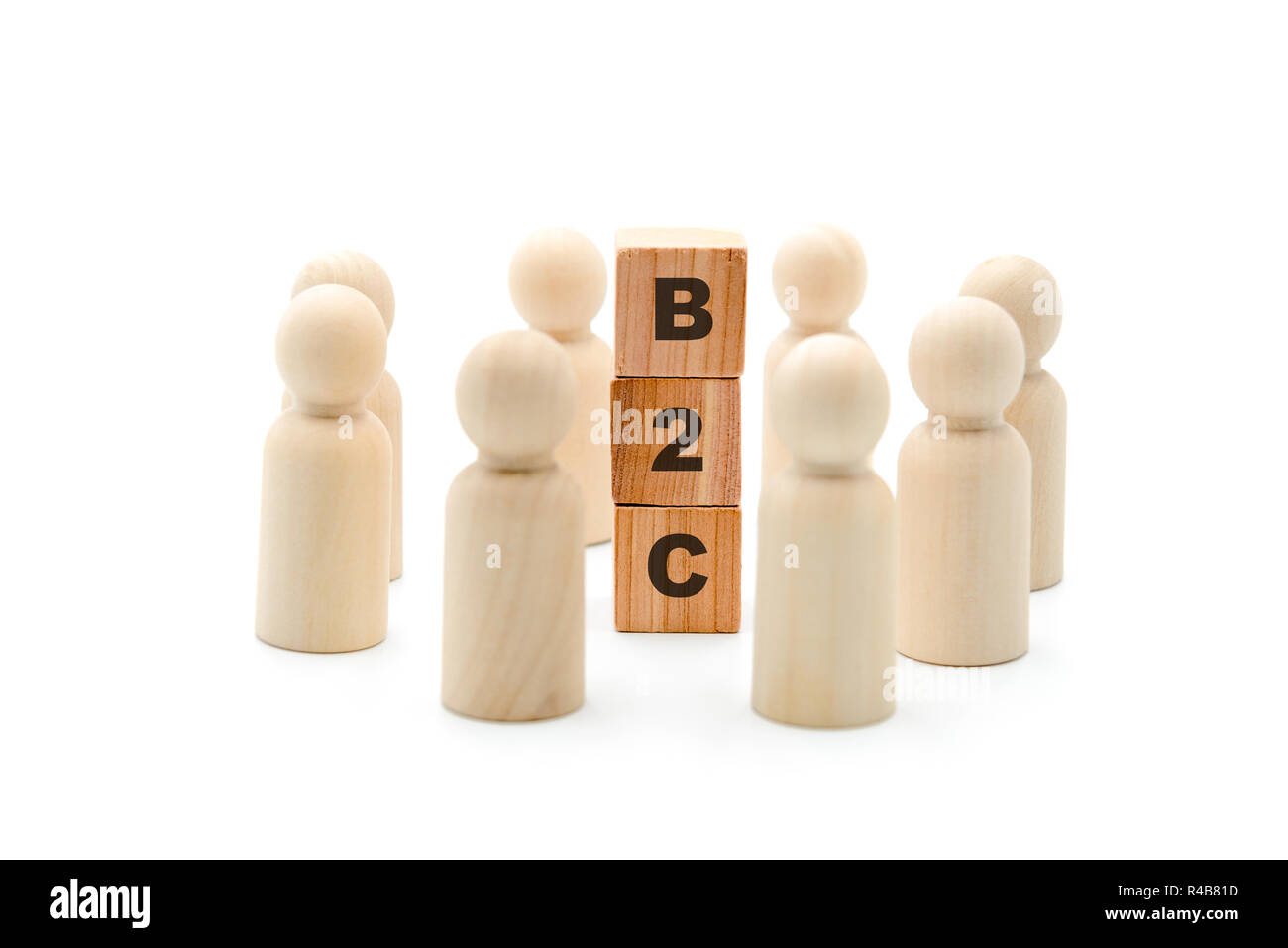 Wooden figures as business team in circle around acronym B2C Business ...