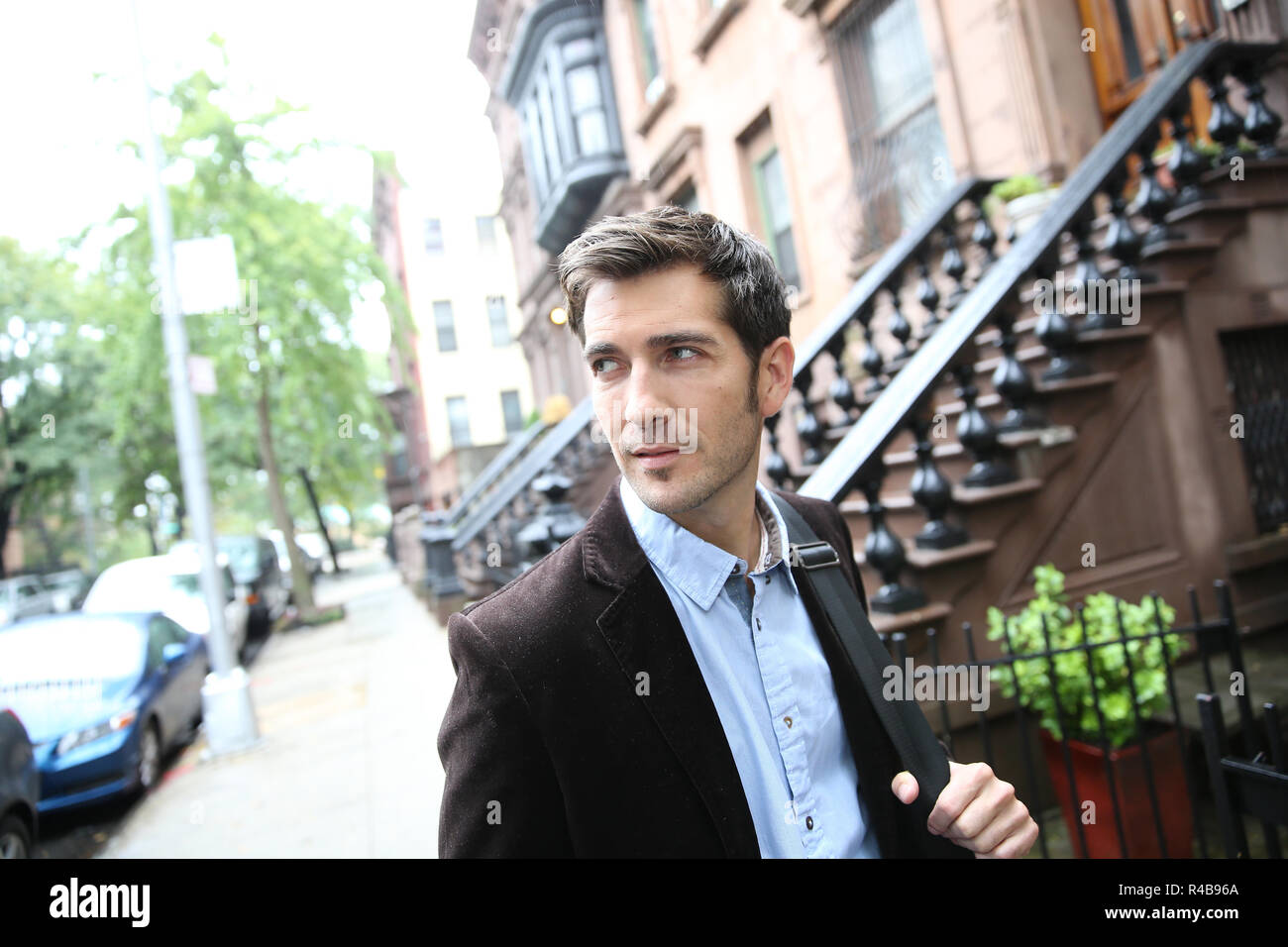 Man walking in a residential street of Manhattan Stock Photo - Alamy