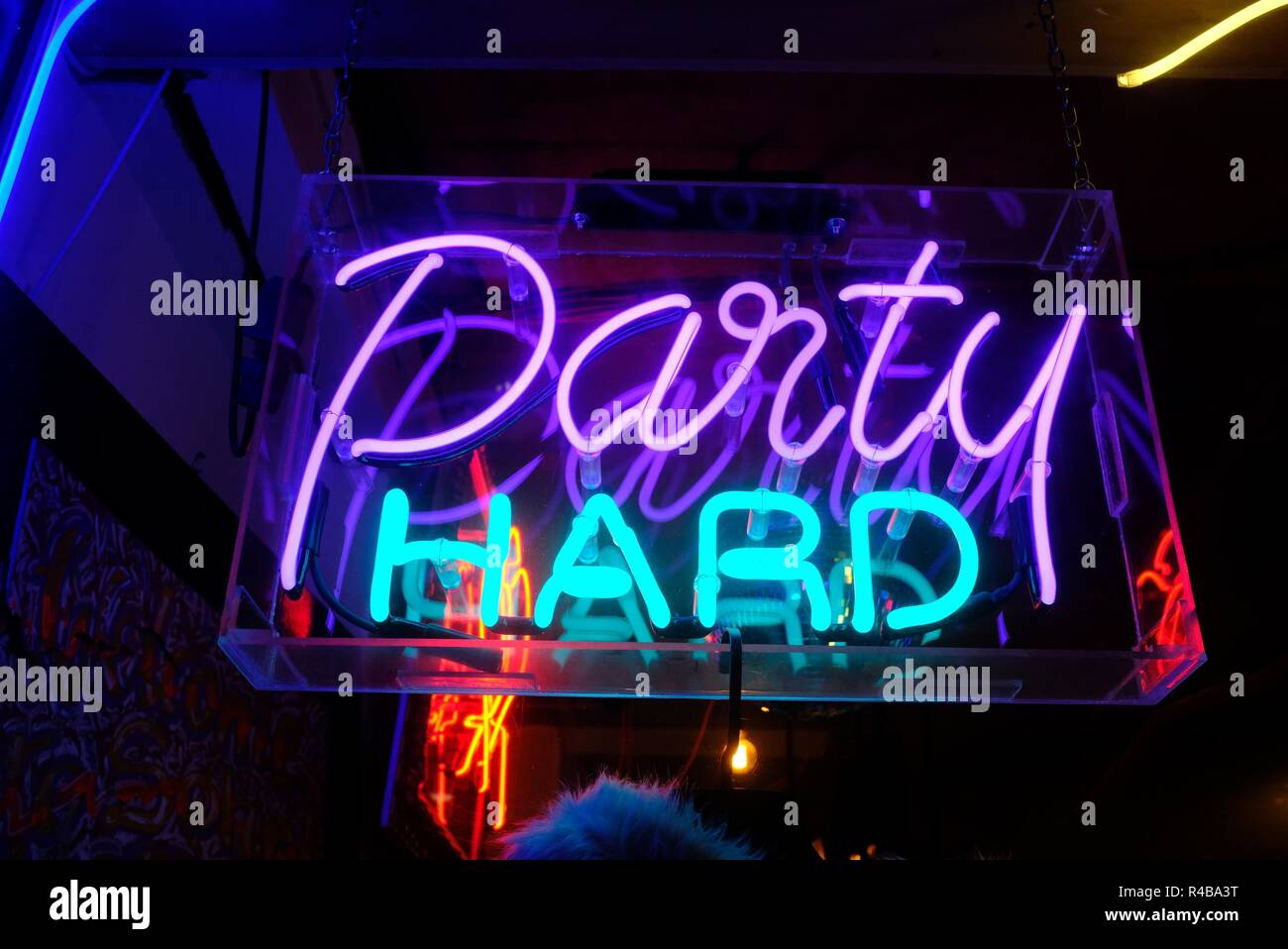 Party Hard Neon Light Sign in Soho, London, England Stock Photo - Alamy