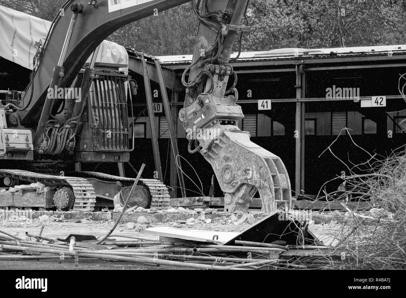 demolition excavator at work on demolition of an old building Stock ...