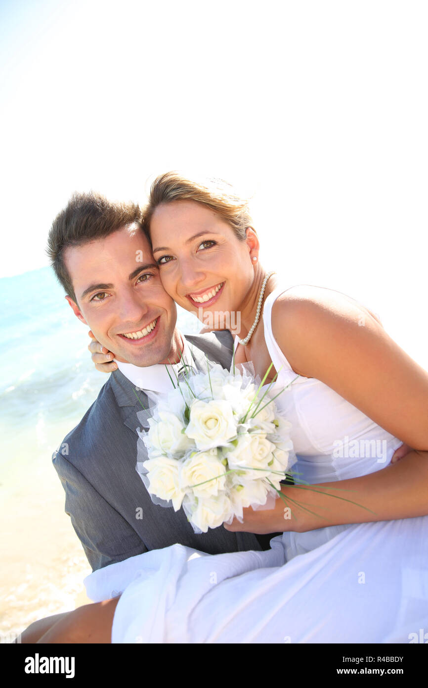 Groom carrying bride in arms hi-res stock photography and images - Alamy