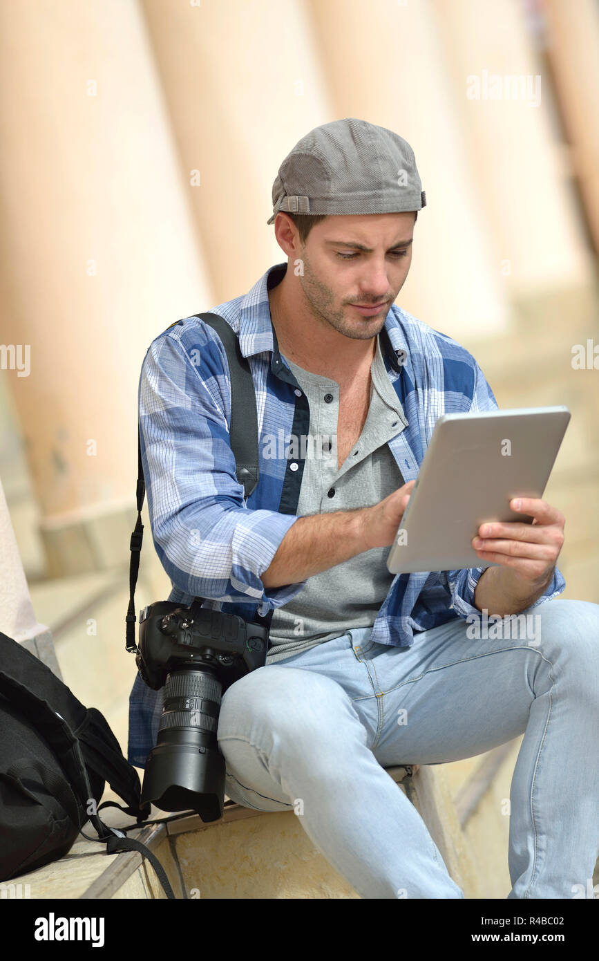 Professional photographer using pad photo hi-res stock photography and ...