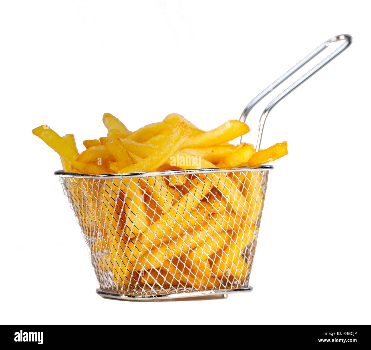 Basket of freshly made French fries on white studio background, France ...