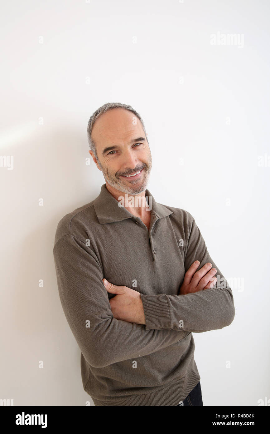 Portrait of 50-year-old man standing on white background Stock Photo ...