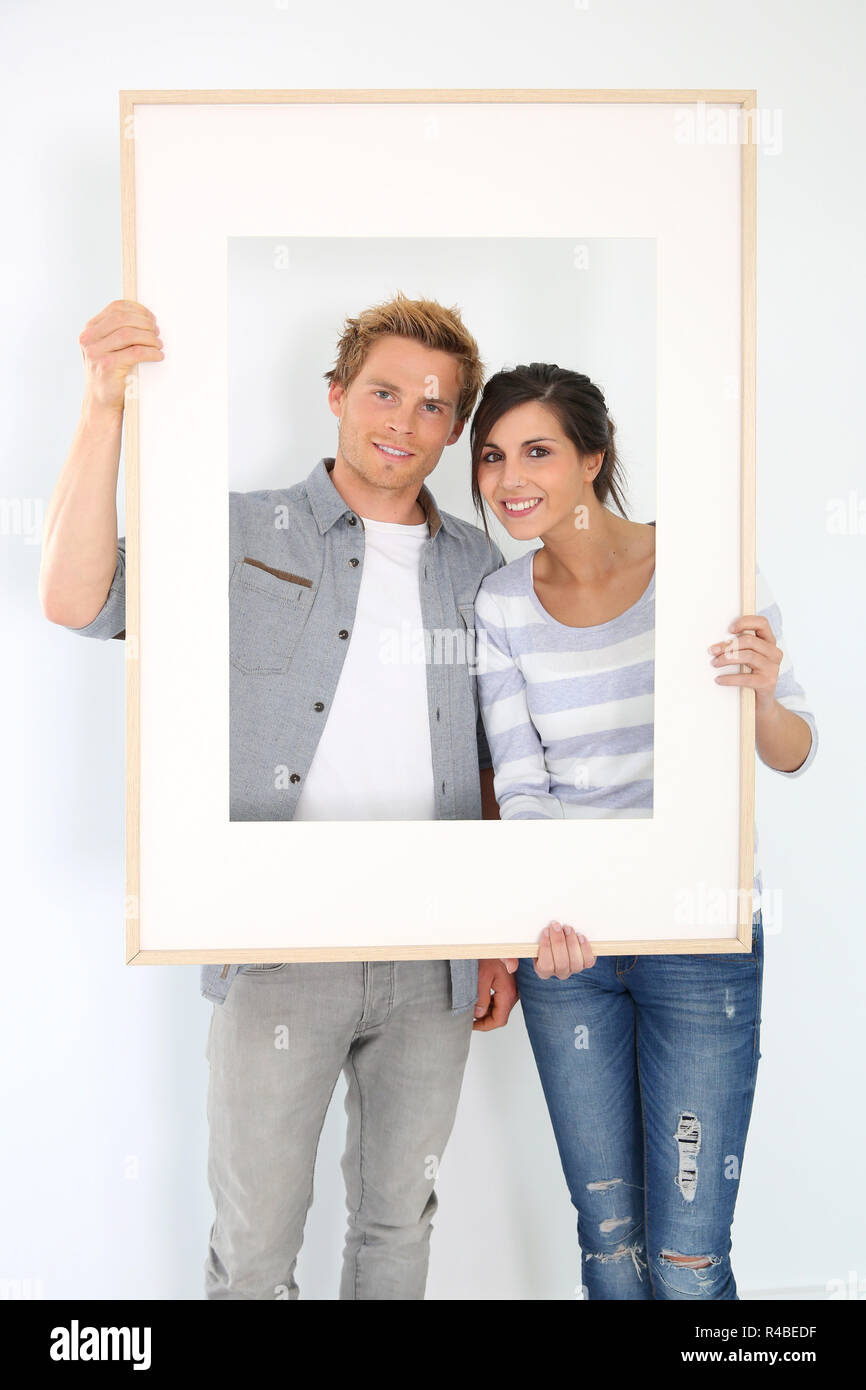 Girls looking through picture frame hi-res stock photography and images ...