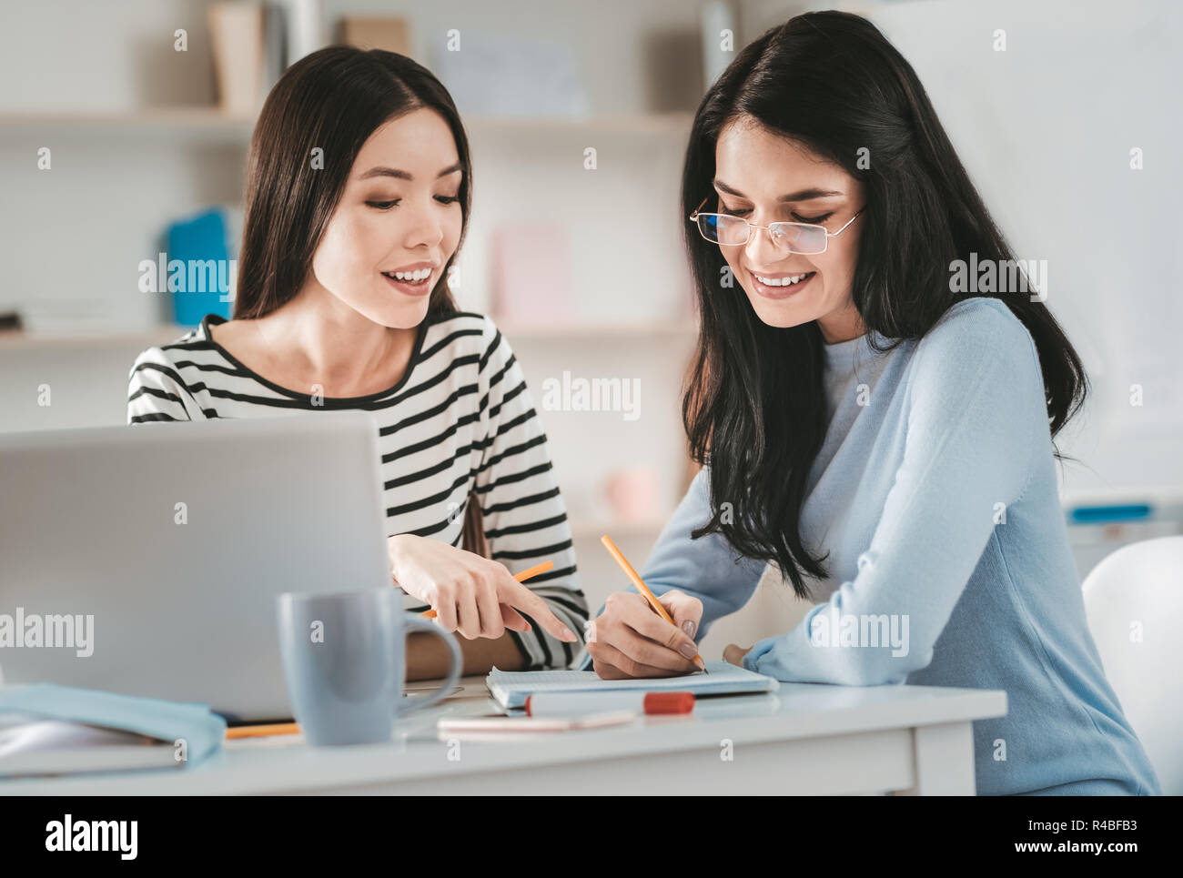 Mutual cooperation. Two creative designers feeling inspired while ...